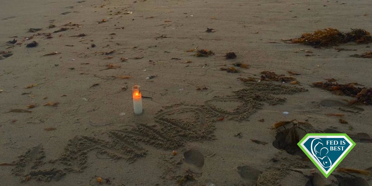 Beach memorial candle, sand writing. - Fed Is Best Foundation